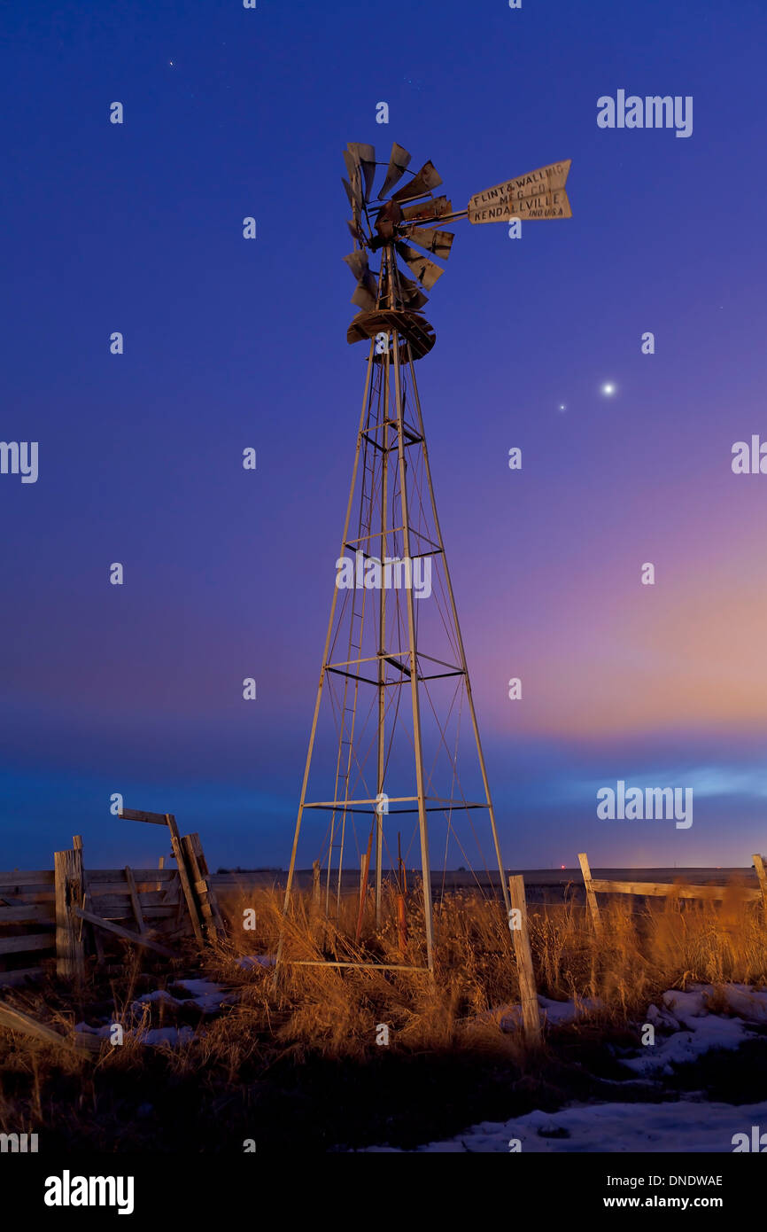 Venus and Jupiter are visible behind an old farm water pump windmill ...
