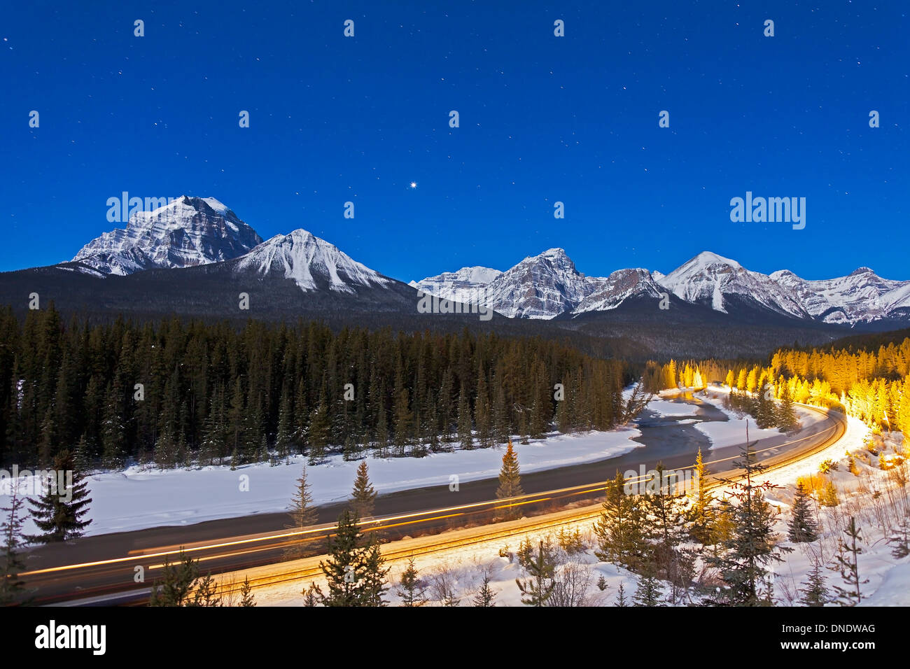 A moonlit nightscape over the Bow River and Morant's Curve in Banff ...