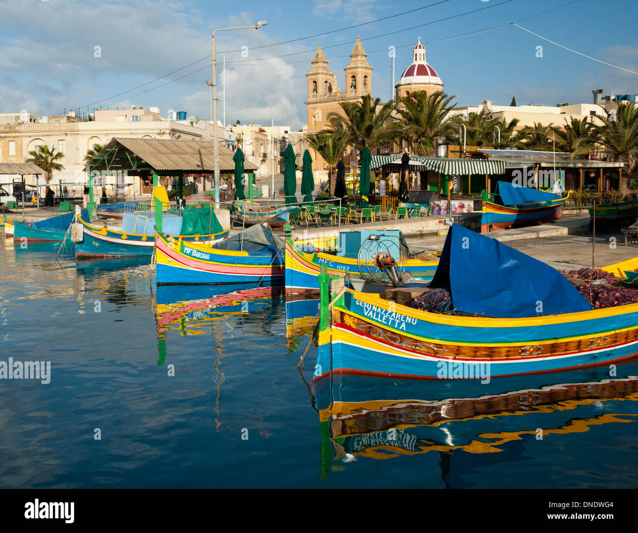 A view of colourful, traditional luzzi (luzzu) fishing boats in ...