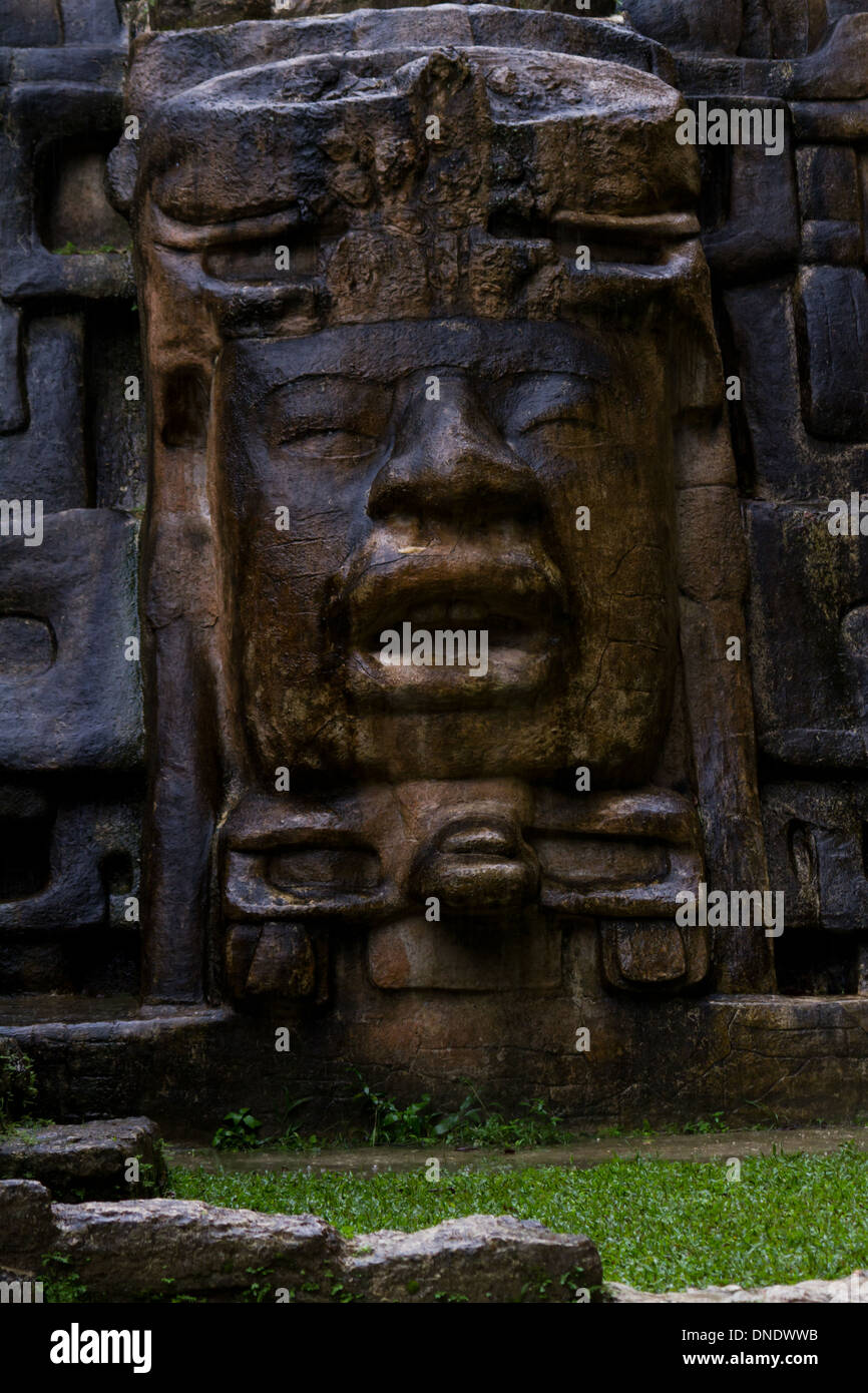 close up of a large rock face on the Mask Temple in Lamanai Belize ...