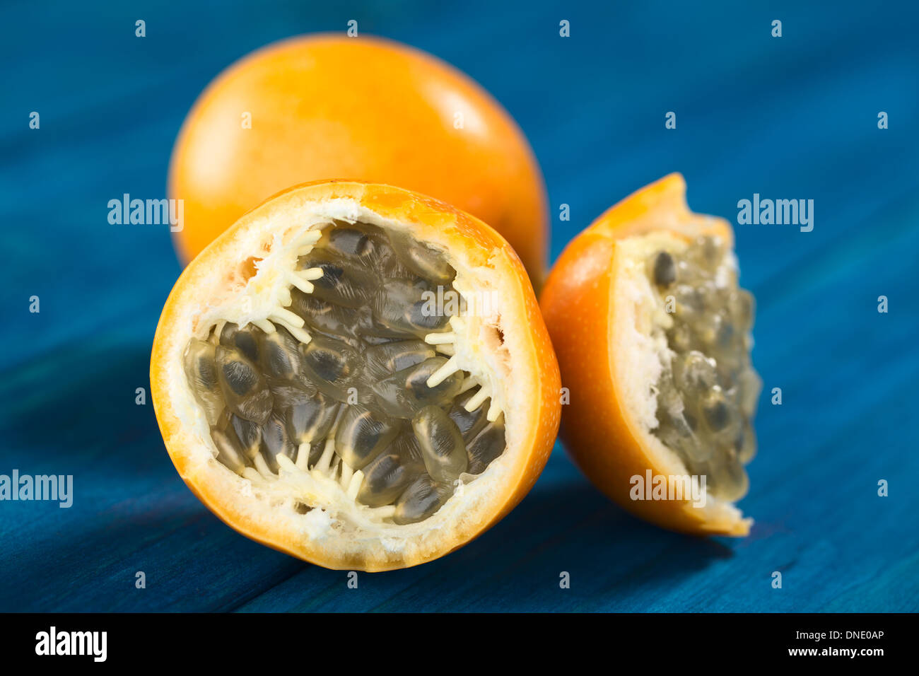 Sweet granadilla or grenadia (lat. Passiflora ligularis) fruit cut in ...