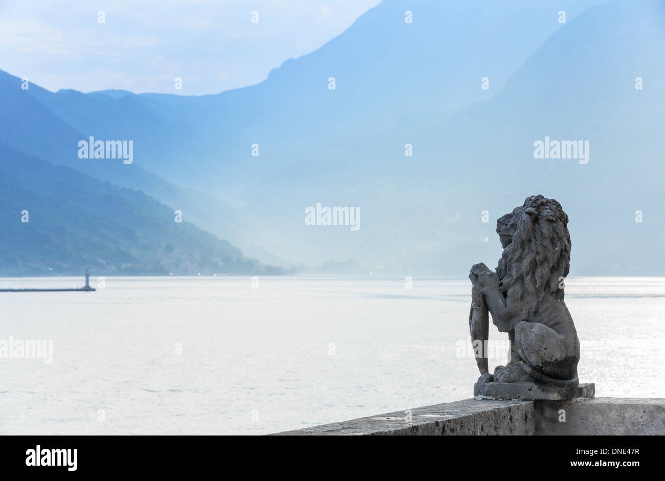 Stone lion ancient statue in Perast town, Bay of Kotor Stock Photo - Alamy