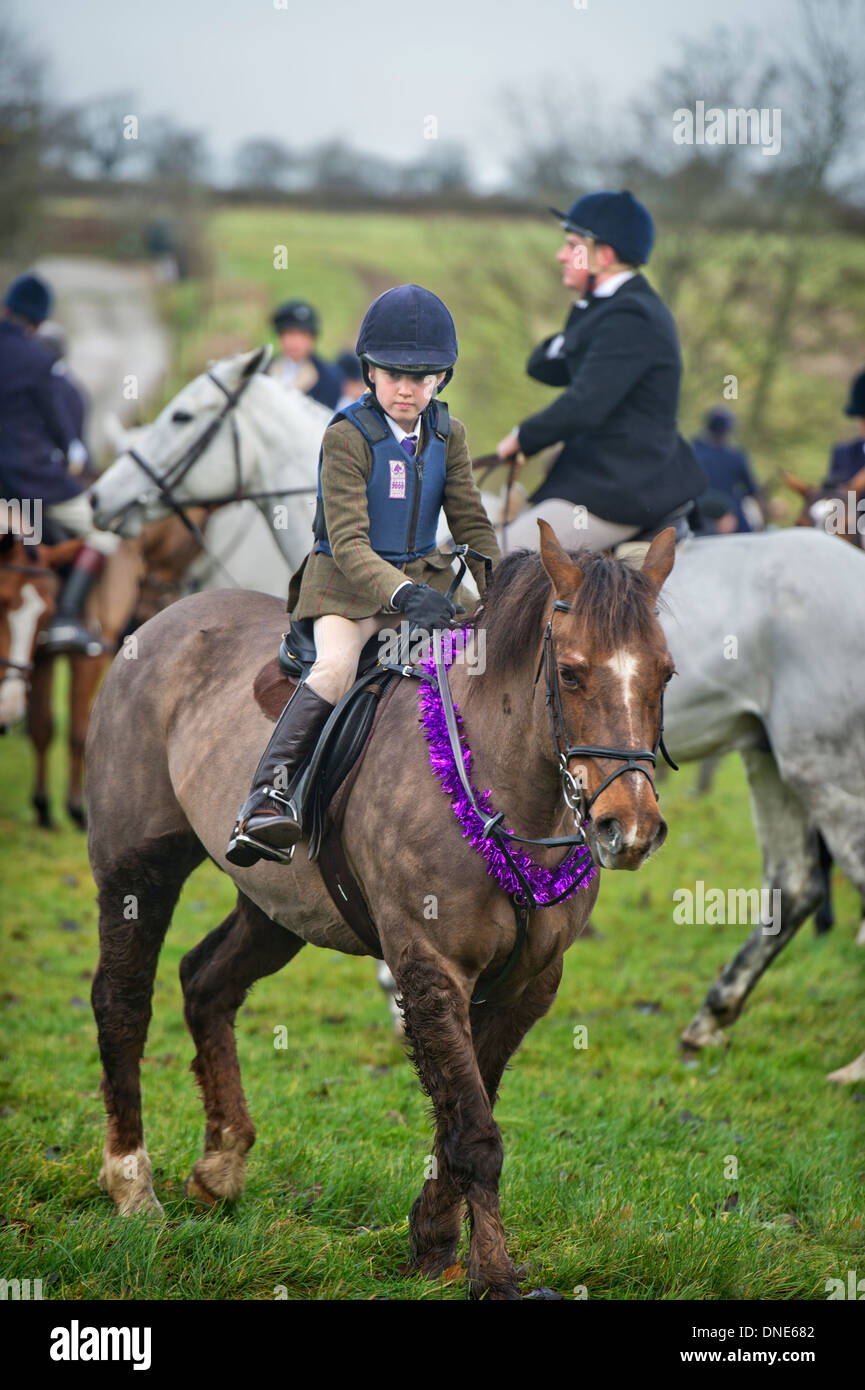 A young horse rider celebrates Christmas by decorating her pony with ...