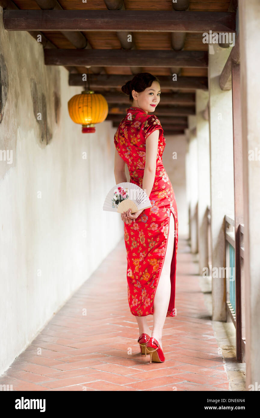 Woman wearing cheongsam and high heels hi-res stock photography and ...