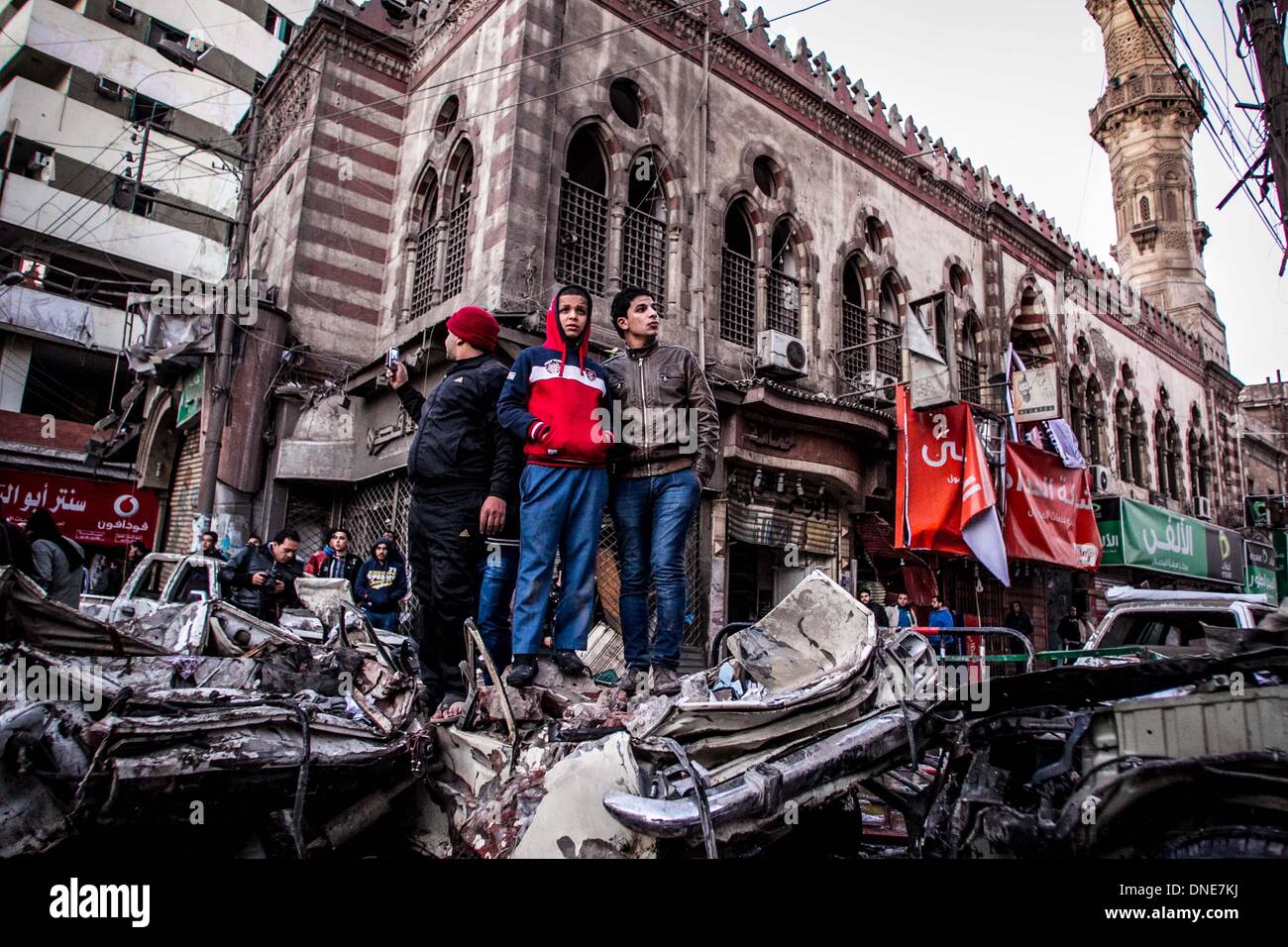 Mansoura, Egypt. 24th Dec, 2013. People gather at the site of explosion ...
