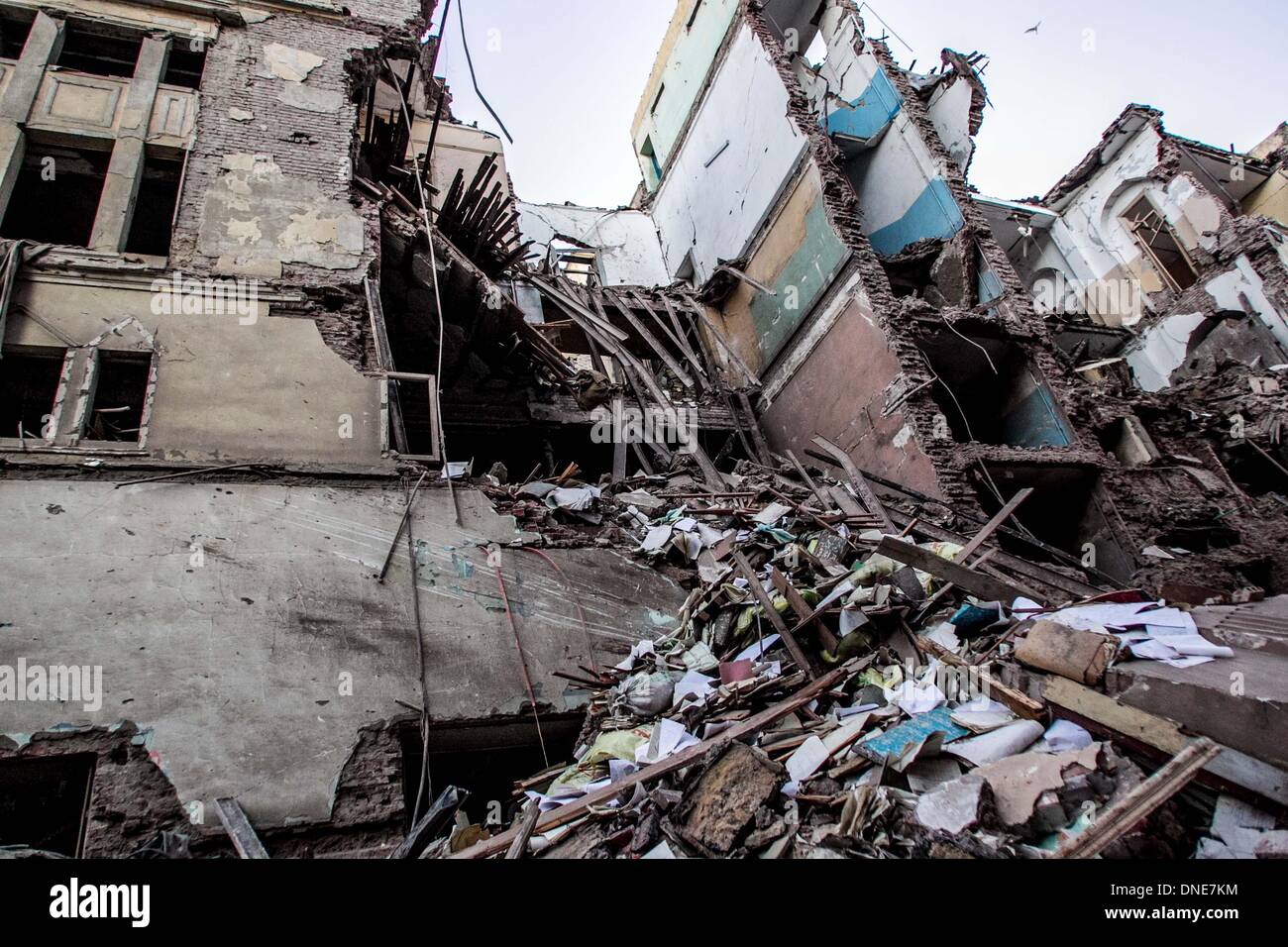 Mansoura, Egypt. 24th Dec, 2013. Destroyed buildings are seen at the ...