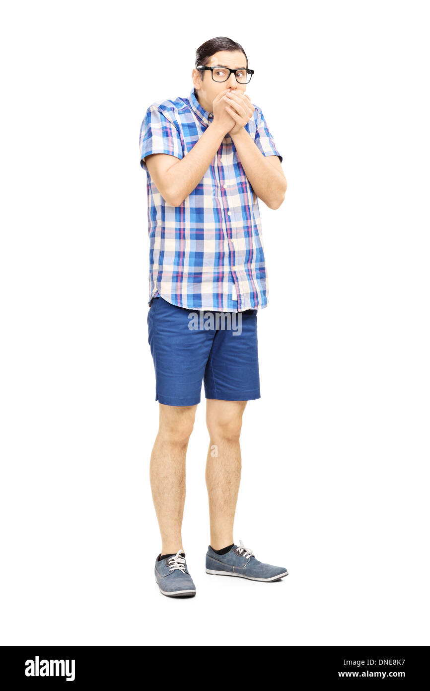 Full length portrait of a frightened young man looking Stock Photo - Alamy