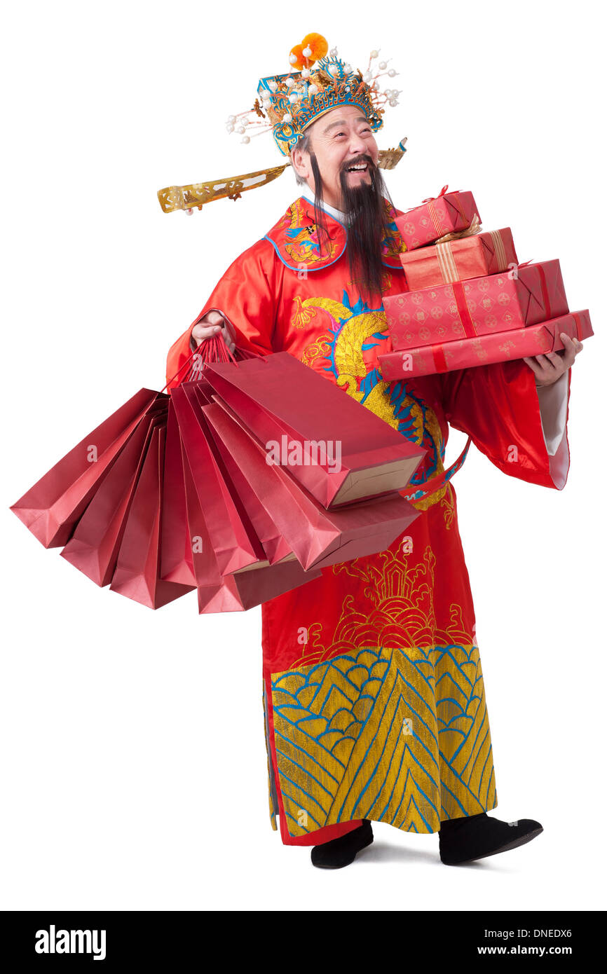 Chinese God of Wealth with gifts Stock Photo - Alamy