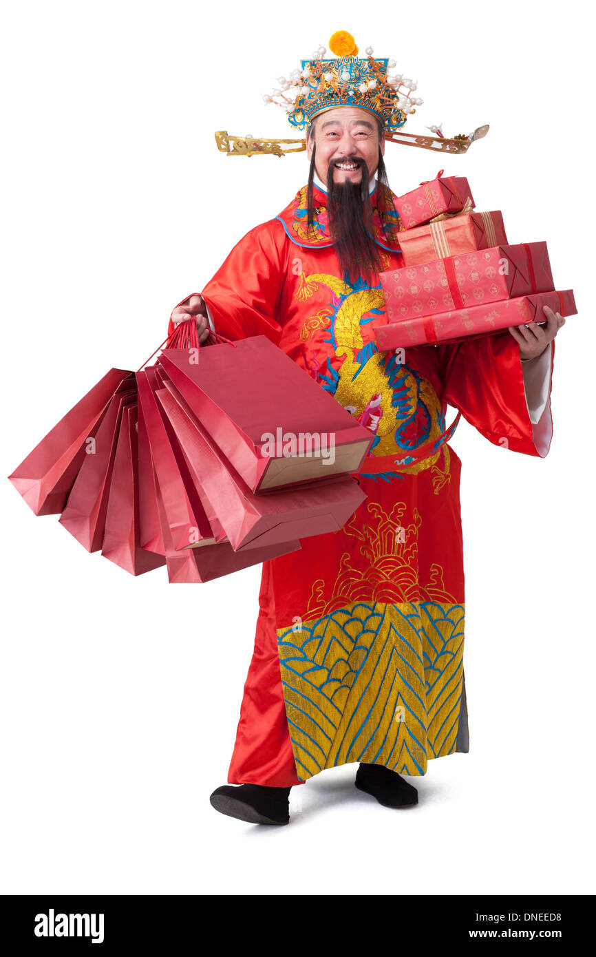 Chinese God of Wealth with gifts Stock Photo - Alamy