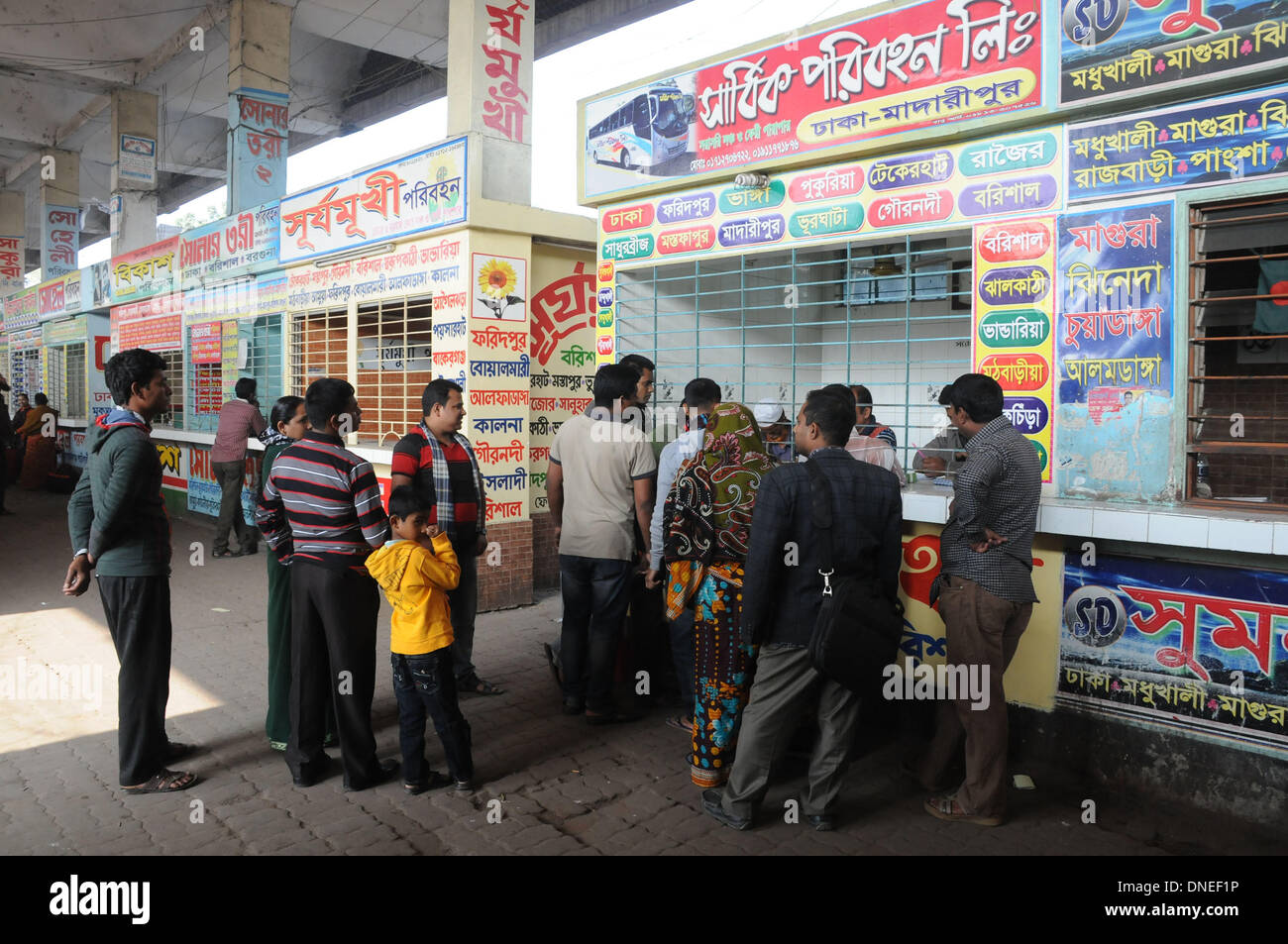Dhaka, Bangladesh. 24th Dec, 2013. Passengers gather at a bus stand ...