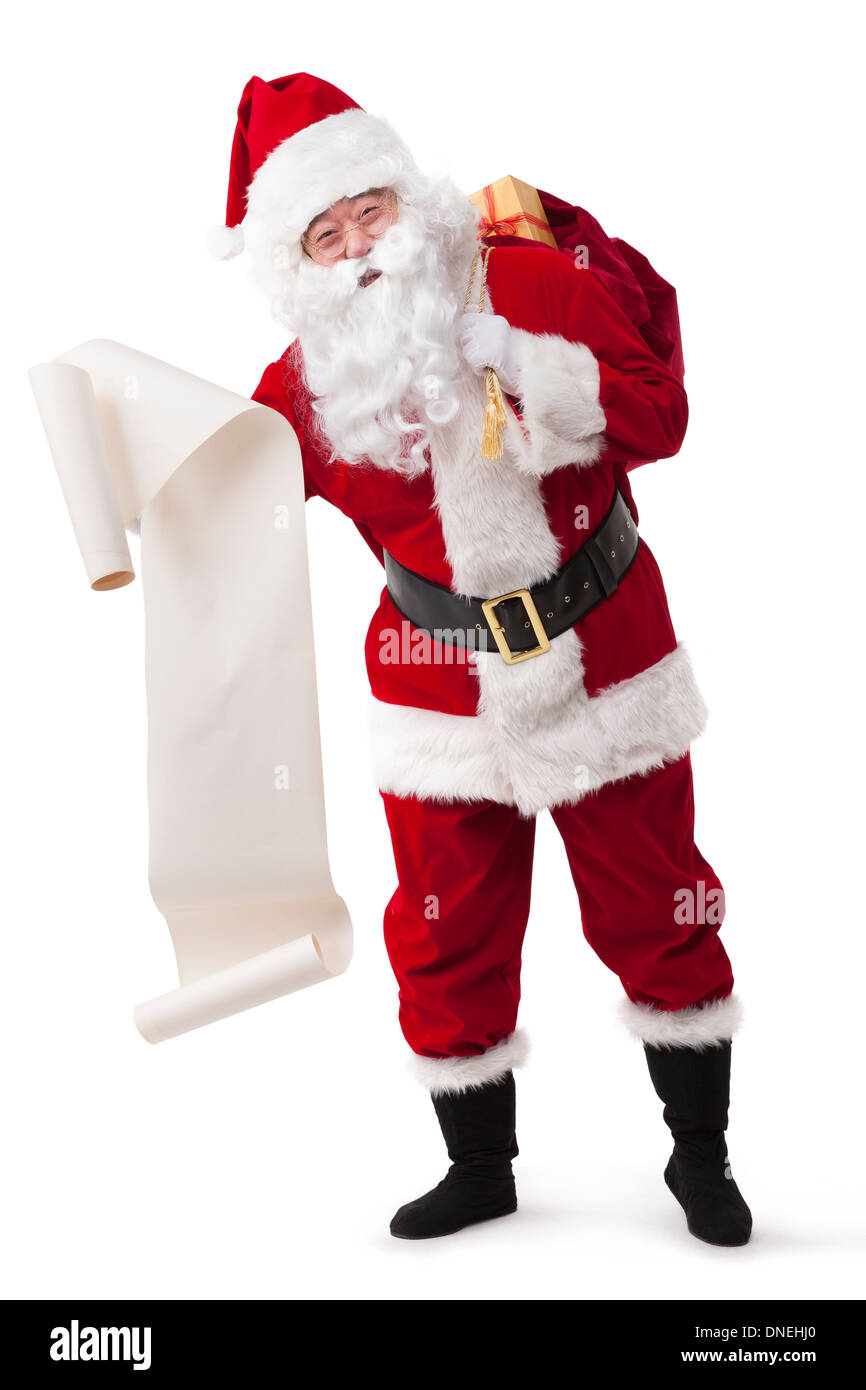 Santa Claus with gifts checking the naughty list Stock Photo - Alamy