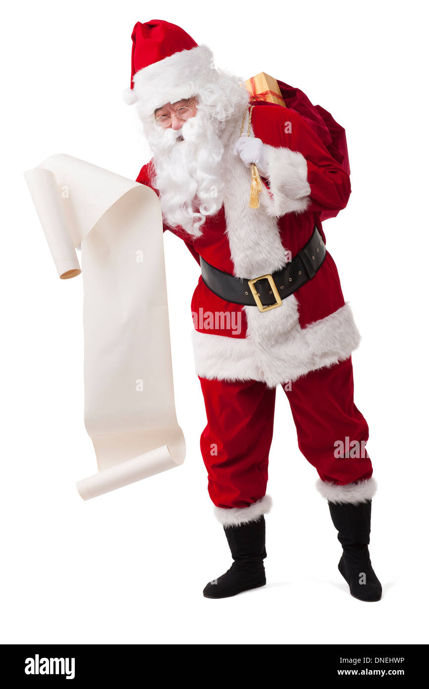 Santa Claus with gifts checking the naughty list Stock Photo - Alamy