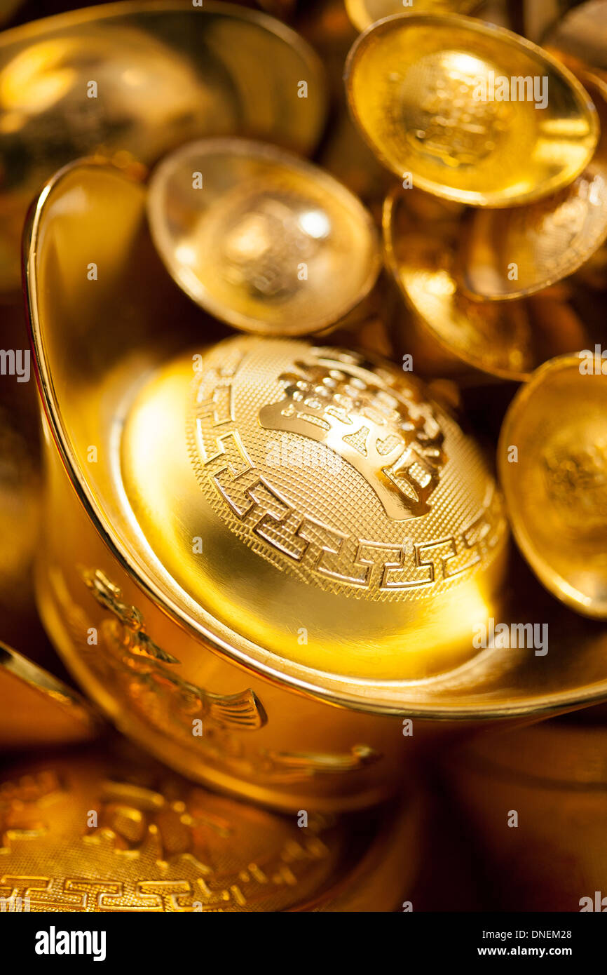 Chinese traditional currency gold yuanbao ingots Stock Photo - Alamy