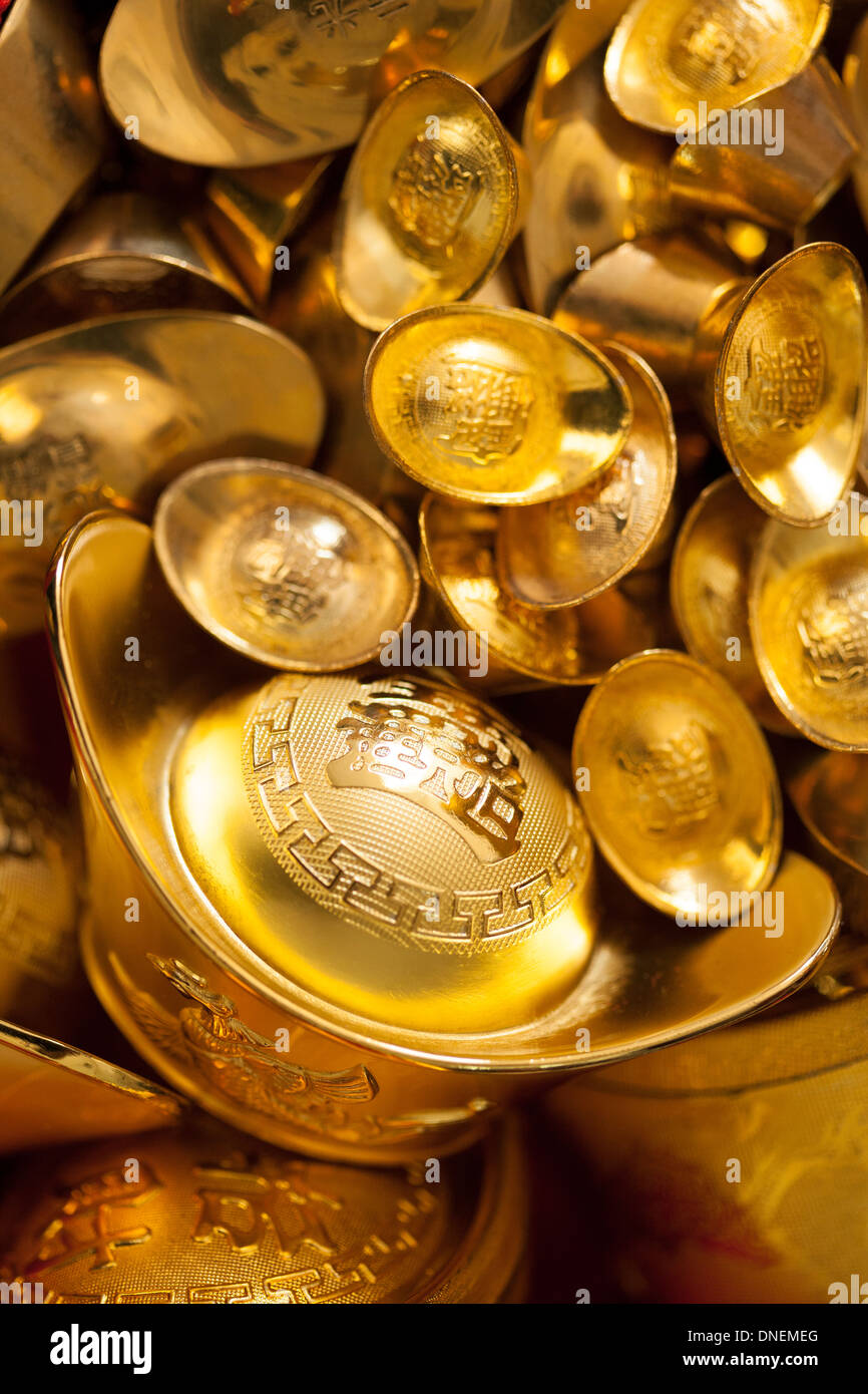 Chinese traditional currency gold yuanbao ingots Stock Photo - Alamy