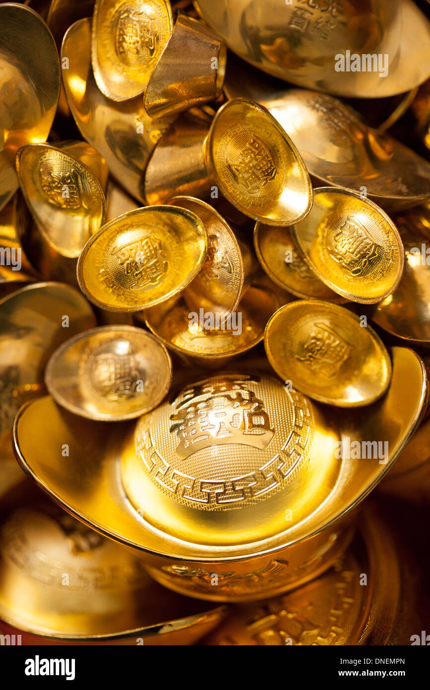 Chinese traditional currency gold yuanbao ingots Stock Photo - Alamy