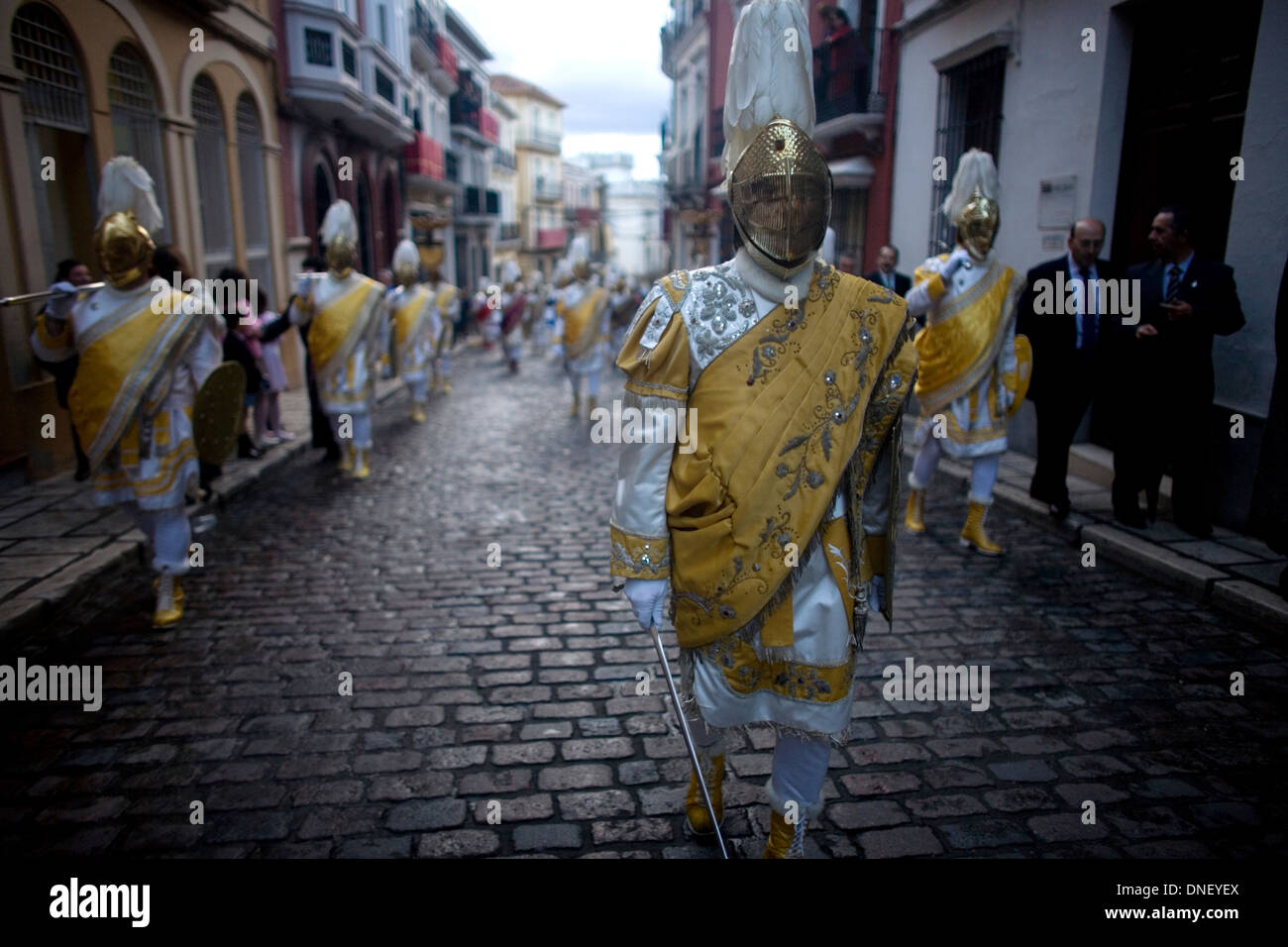 Men dressed as Roman legionaries parade through the street during an ...