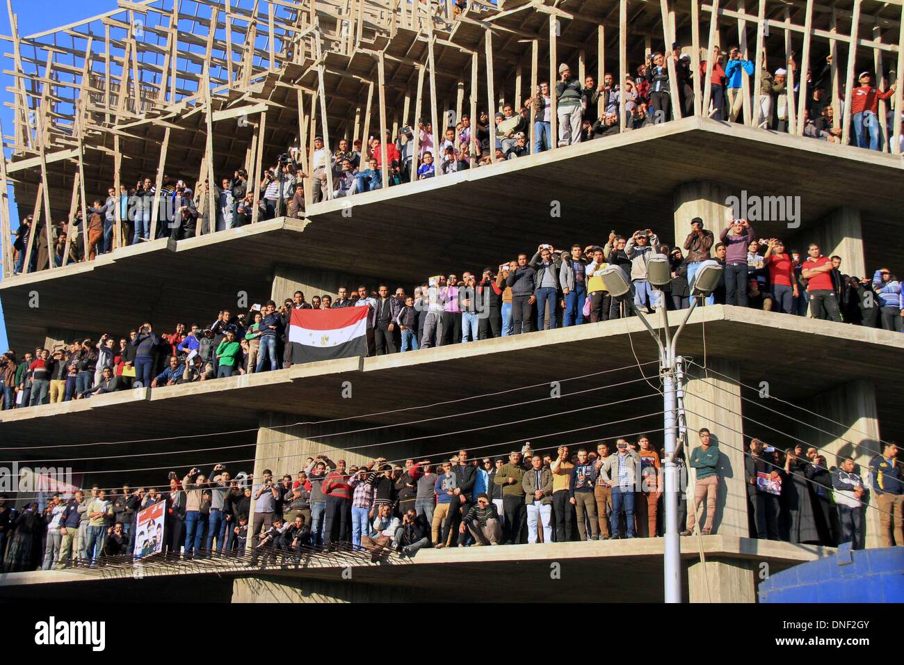 Mansura, Cairo, Egypt. 24th Dec, 2013. Egyptian mourners participate in ...
