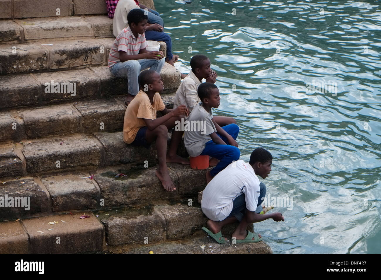 Children in Stone Town also known as Mji Mkongwe in the old part of ...