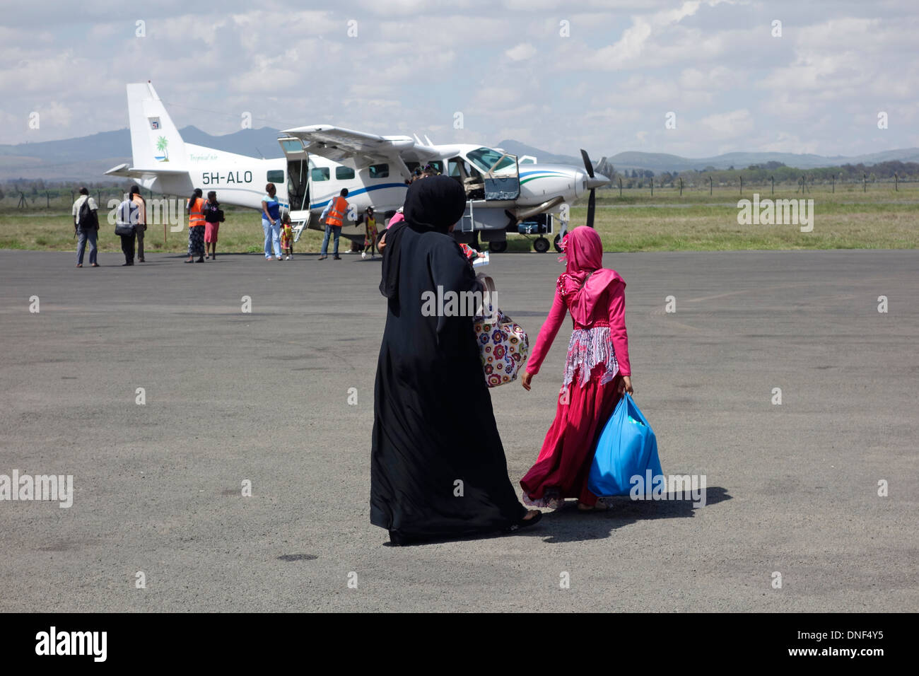 Passengers boarding a Let L-410 Turbolet twin-engine short-range ...