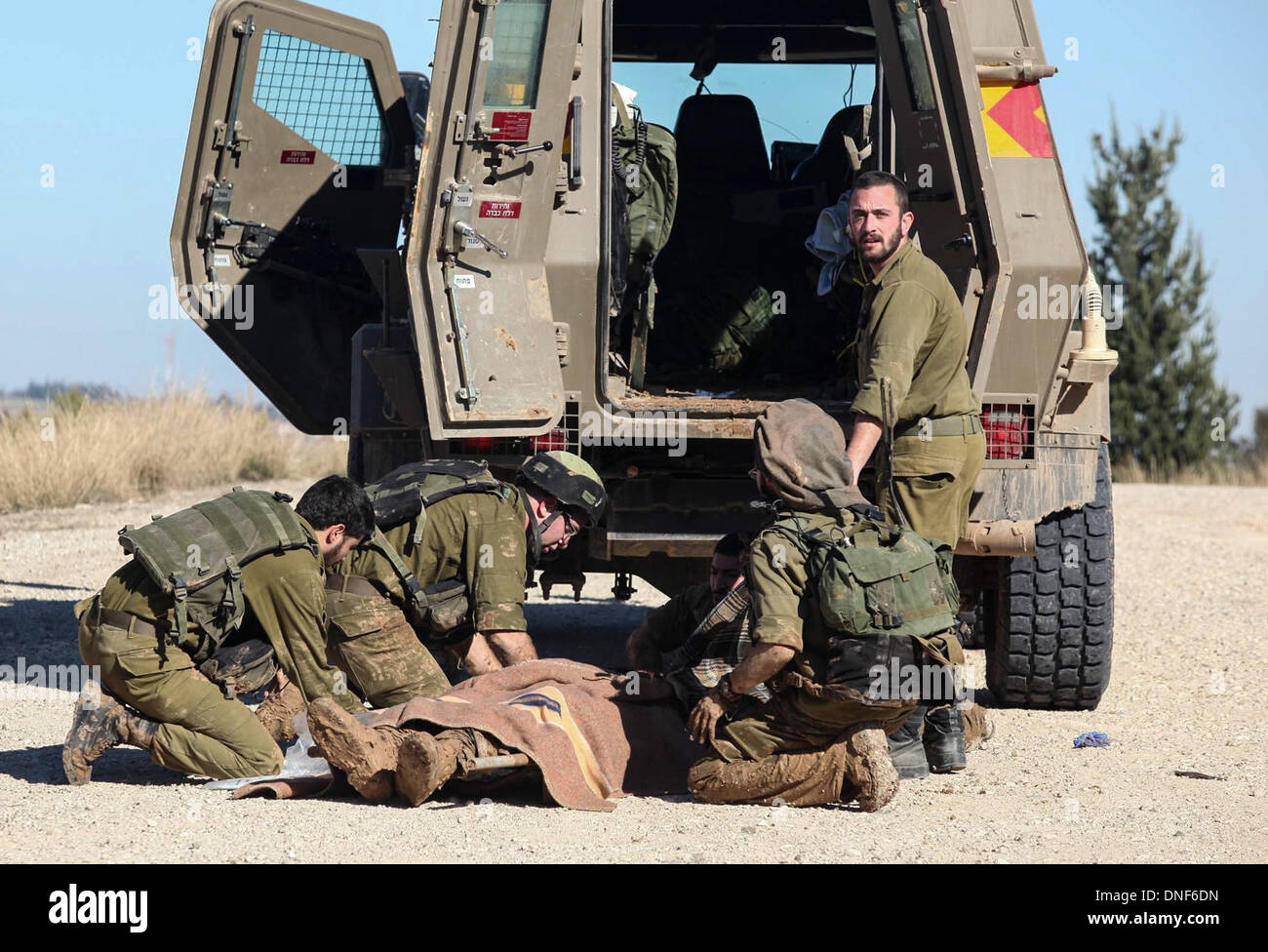 Jerusalem. 24th Dec, 2013. Israeli military medical workers treat an ...