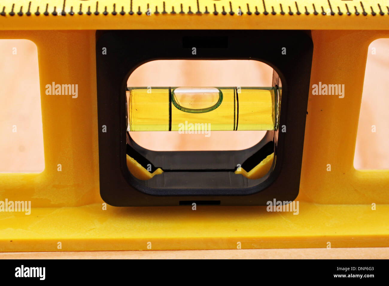 A close up image of a leveling tool being used Stock Photo - Alamy