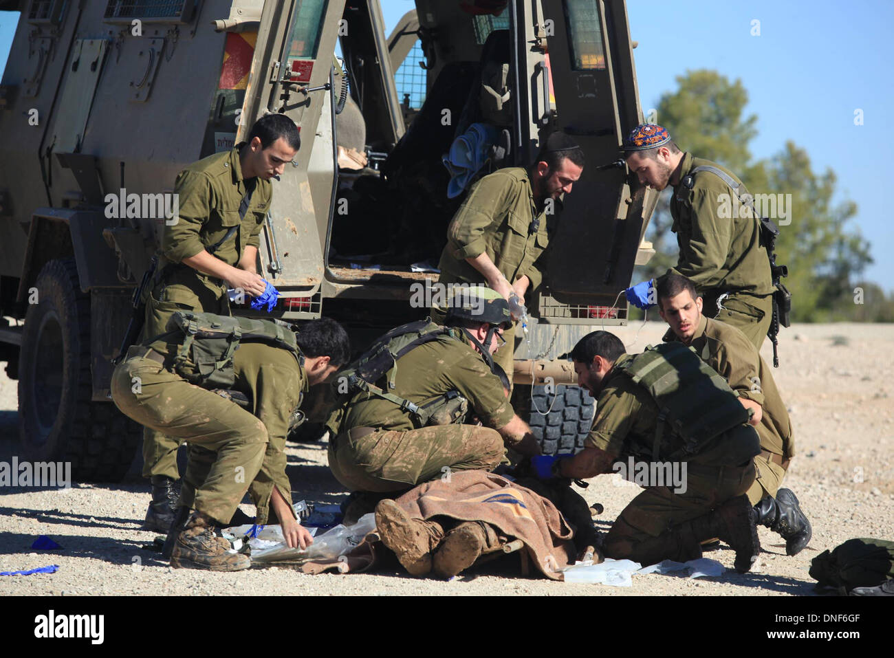 Jerusalem. 24th Dec, 2013. Israeli military medical workers treat an ...