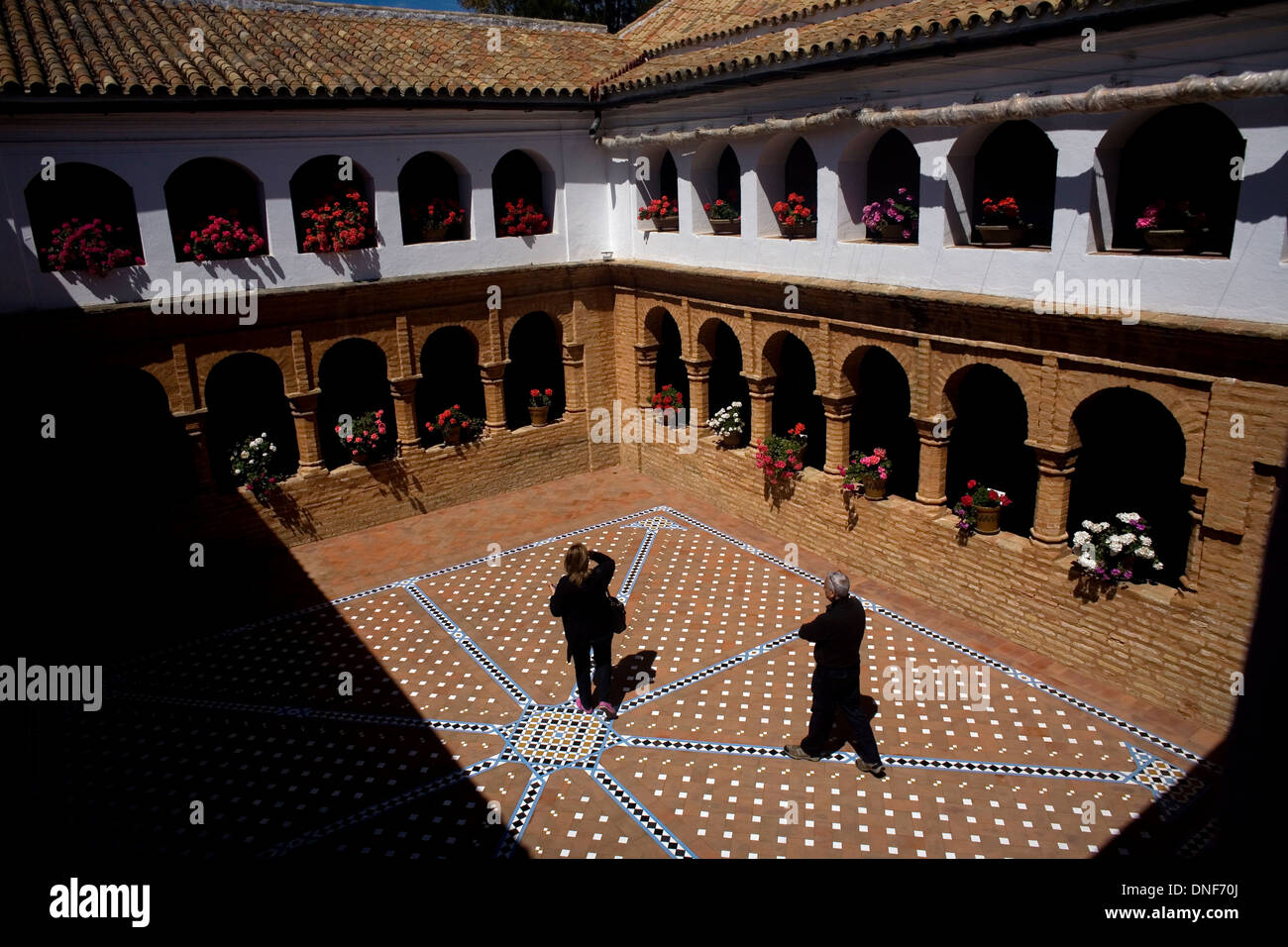 Tourists visit the cloister of La Rabida Monastery in Palos de la ...