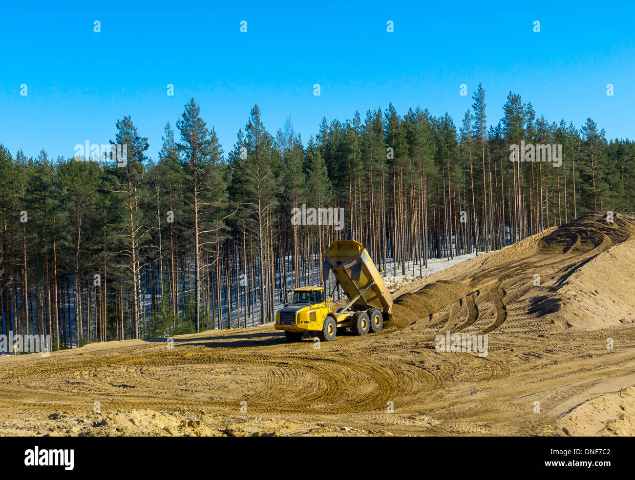 Yellow construction transport Stock Photo - Alamy