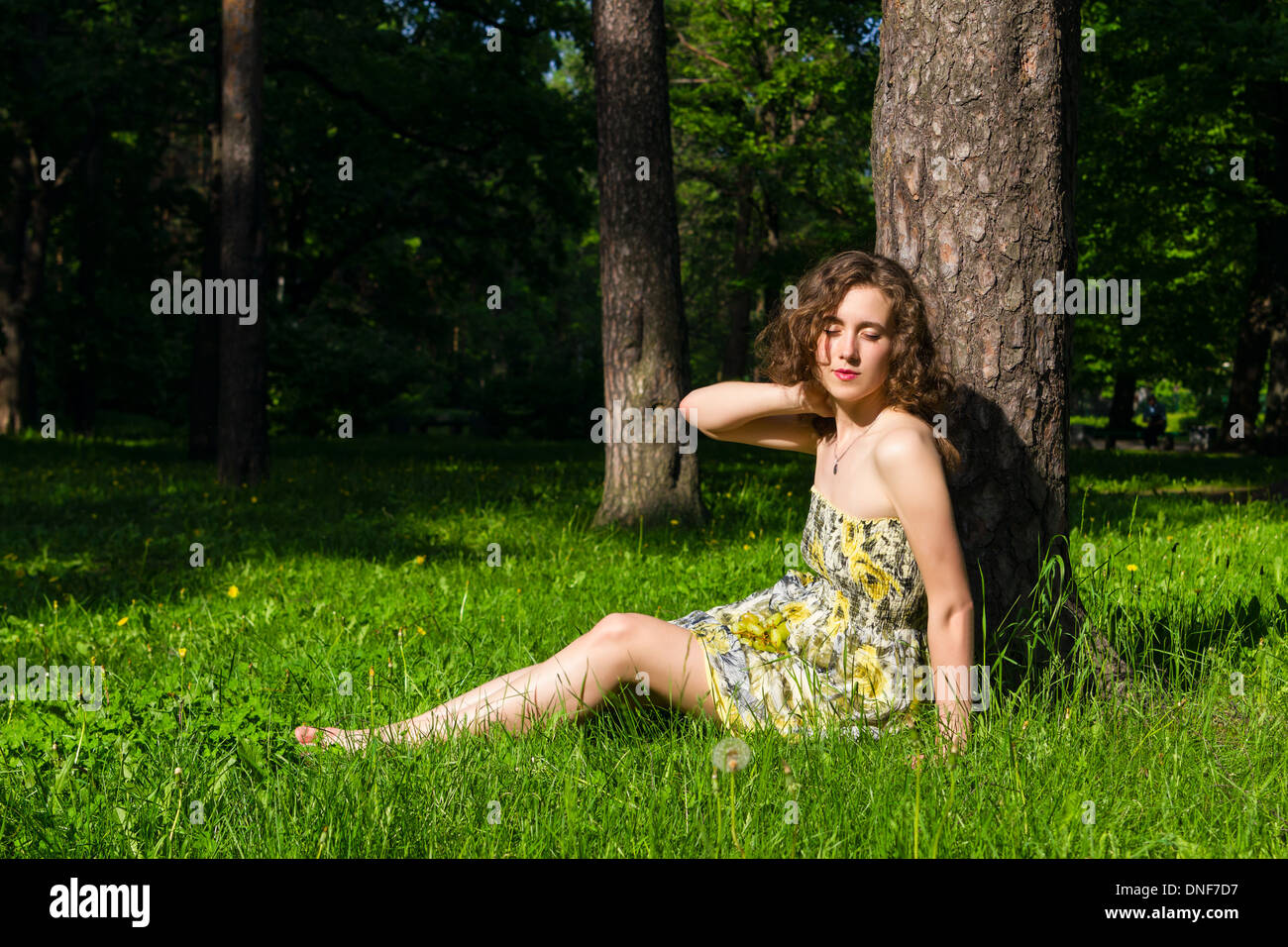 Woman having rest on meadow Stock Photo - Alamy