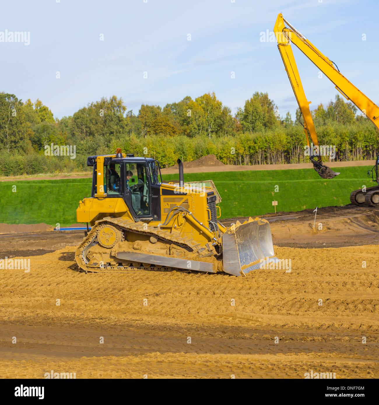 Yellow construction transport Stock Photo - Alamy
