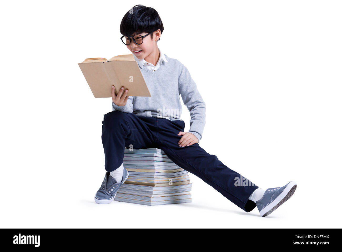 Cute boy reading Stock Photo - Alamy