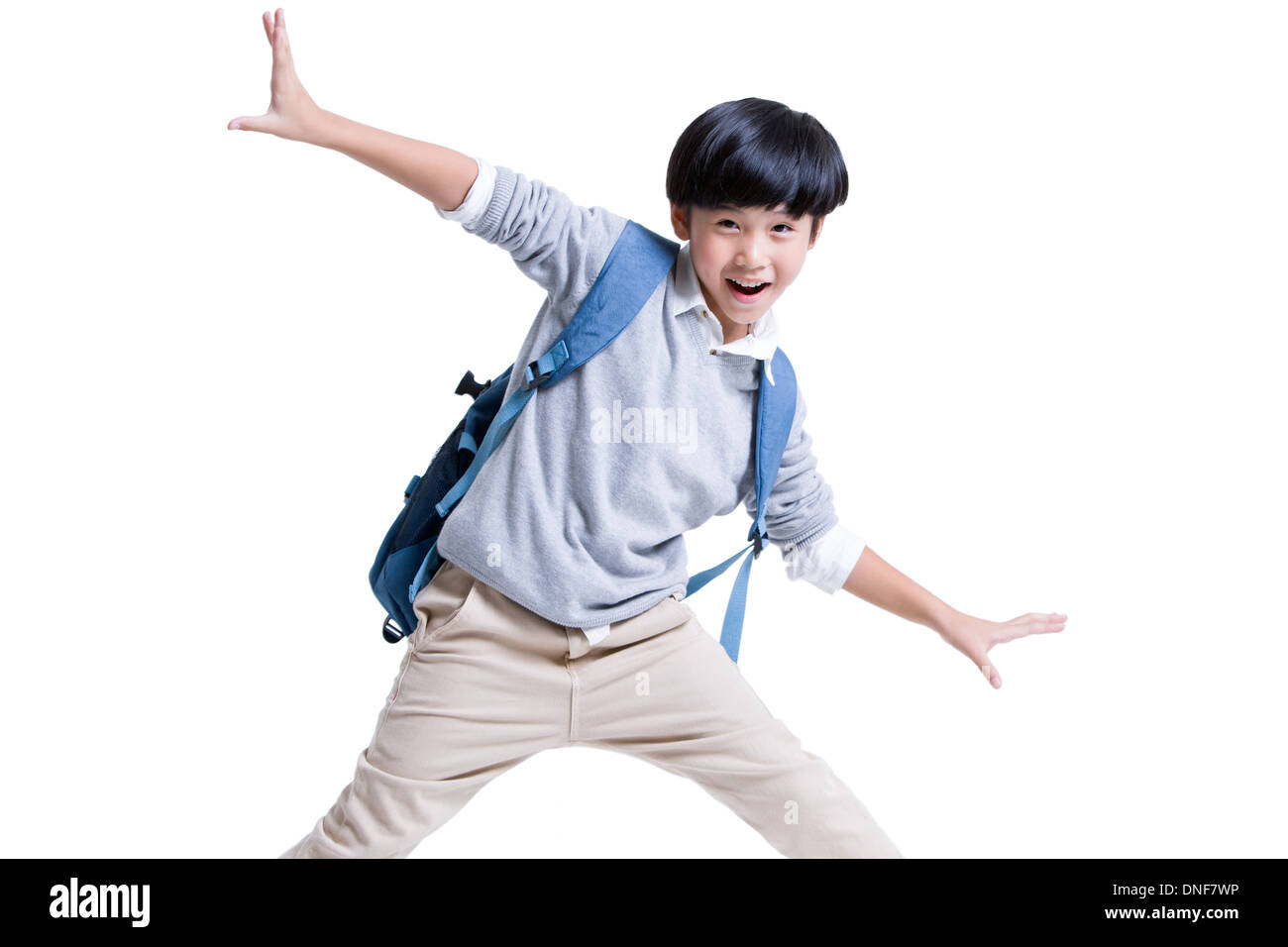 Excited boy with schoolbag on back Stock Photo - Alamy