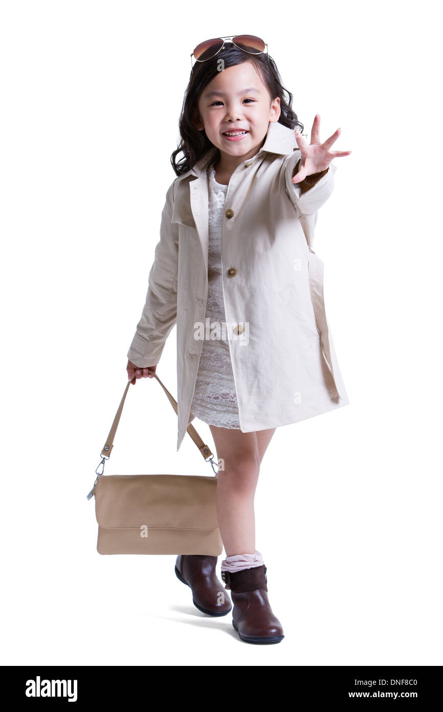 Happy little girl reaching out hand Stock Photo - Alamy