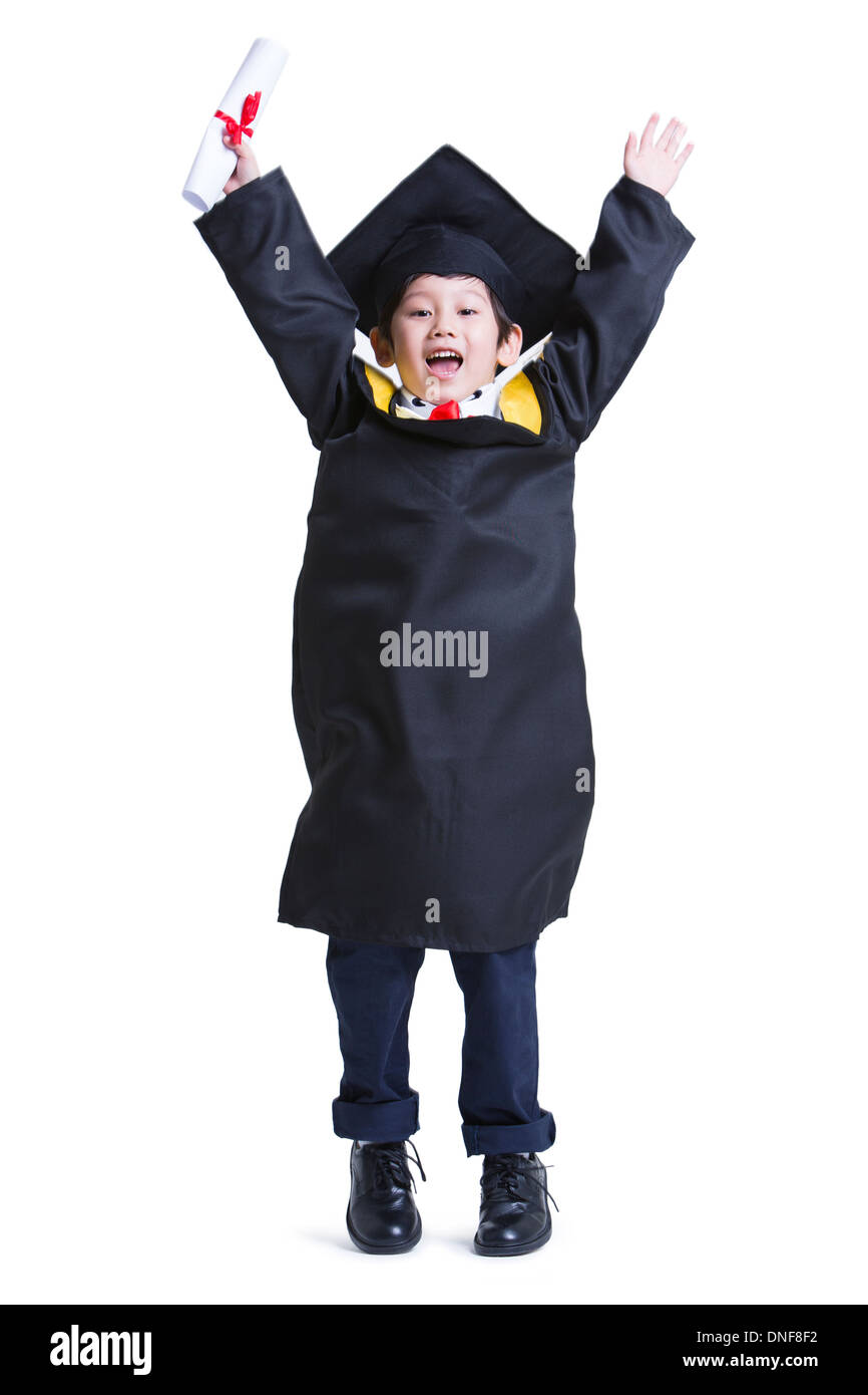 Cute boy in graduation gown celebrating Stock Photo - Alamy