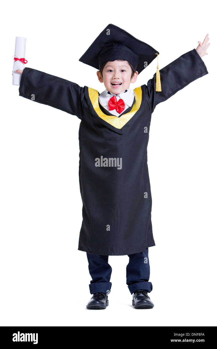 Cute boy in graduation gown Stock Photo - Alamy