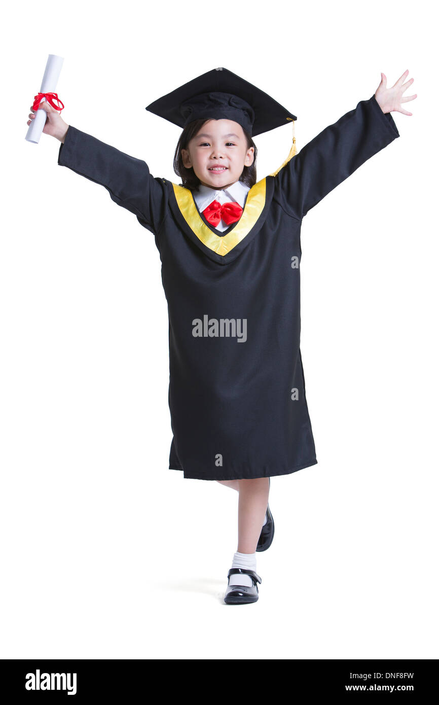 Cute girl in graduation gown Stock Photo - Alamy