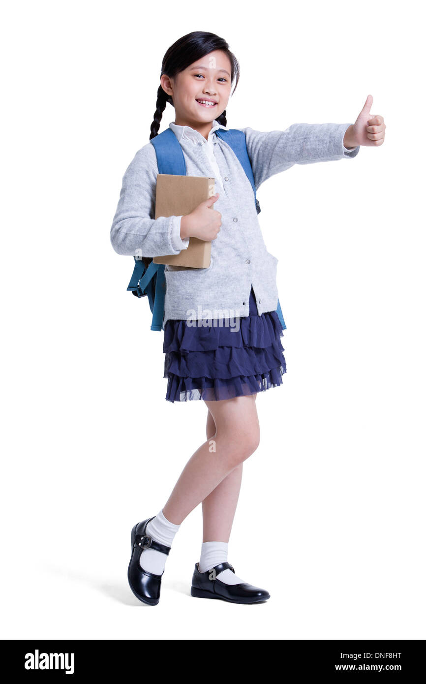 Happy schoolgirl doing thumbs up Stock Photo - Alamy