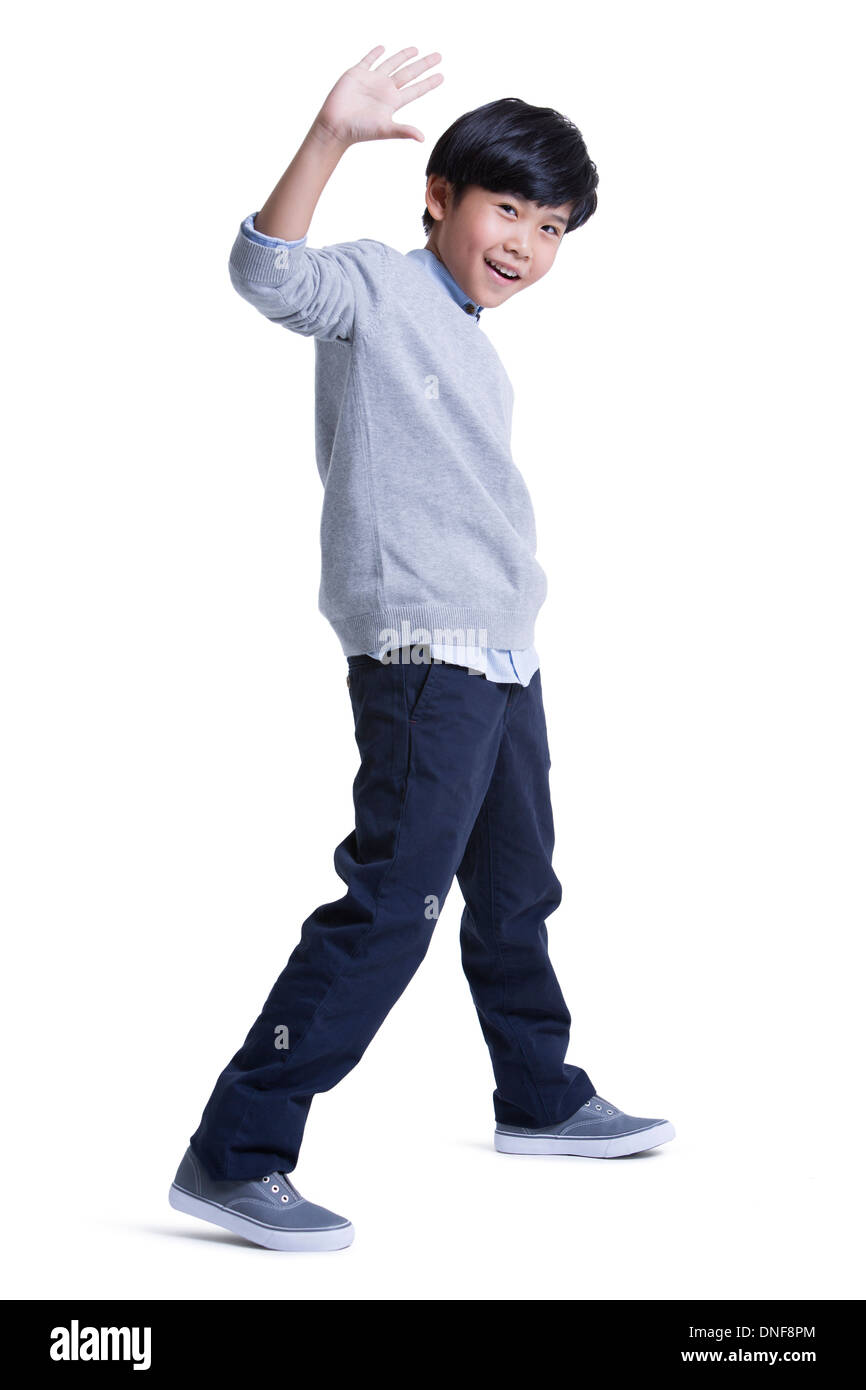 Happy boy waving Stock Photo - Alamy
