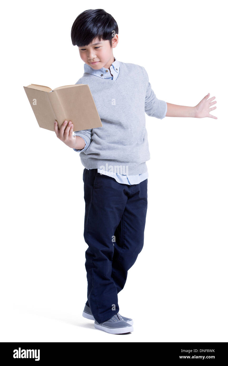 Cute boy reading Stock Photo - Alamy