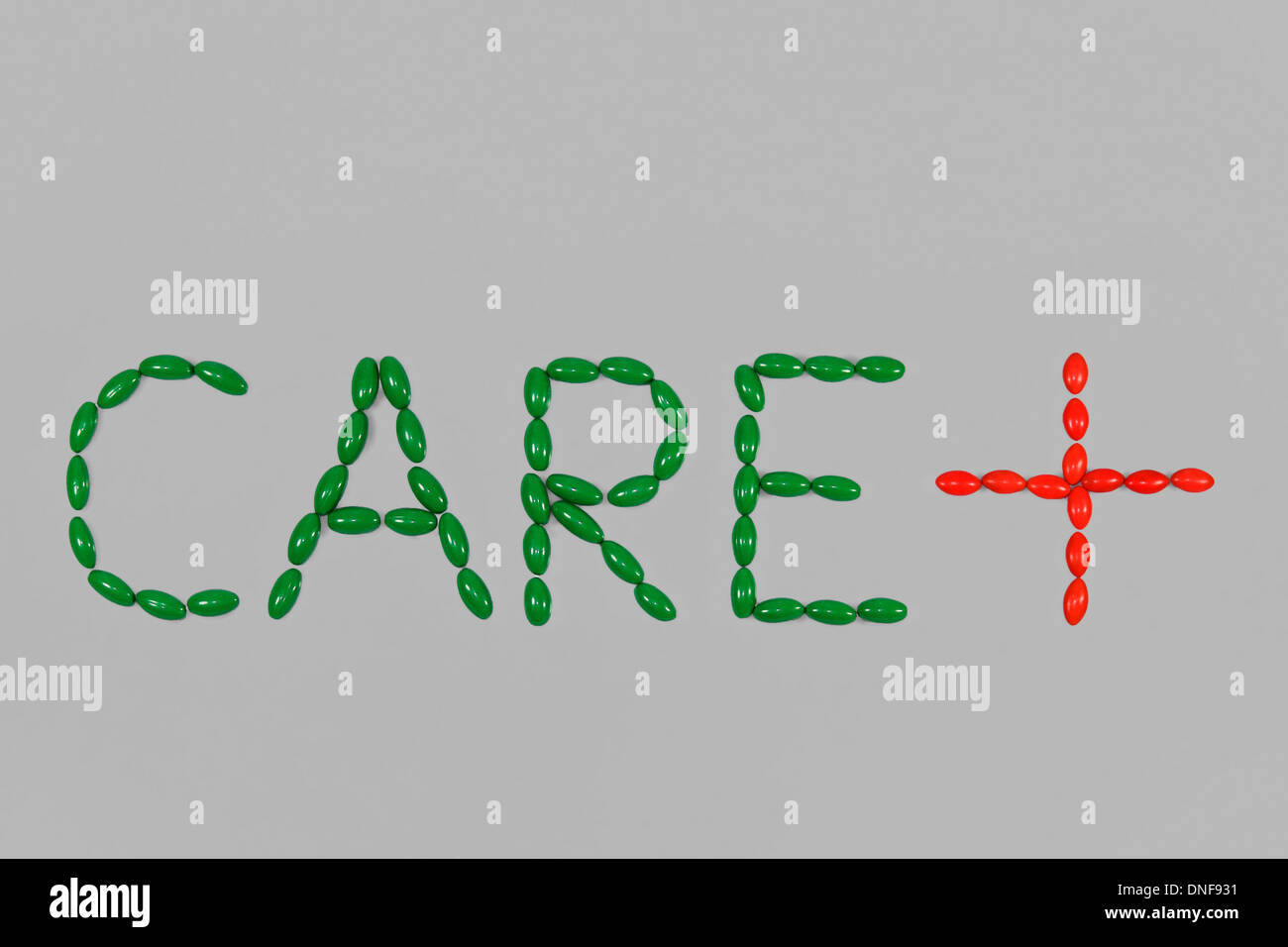 Care Word with cross symbol arranged with pills Stock Photo - Alamy