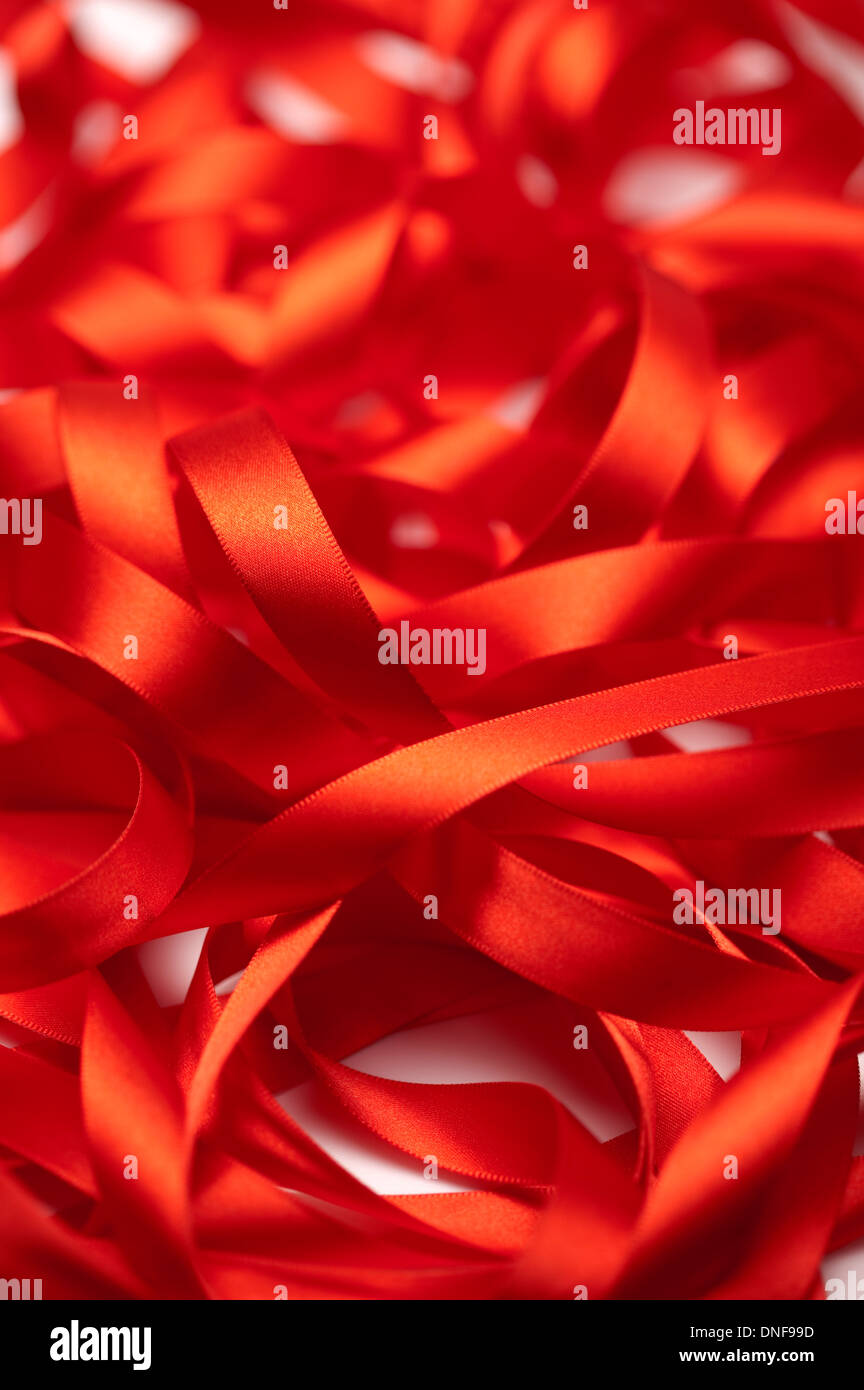 Tangled red ribbon Stock Photo - Alamy