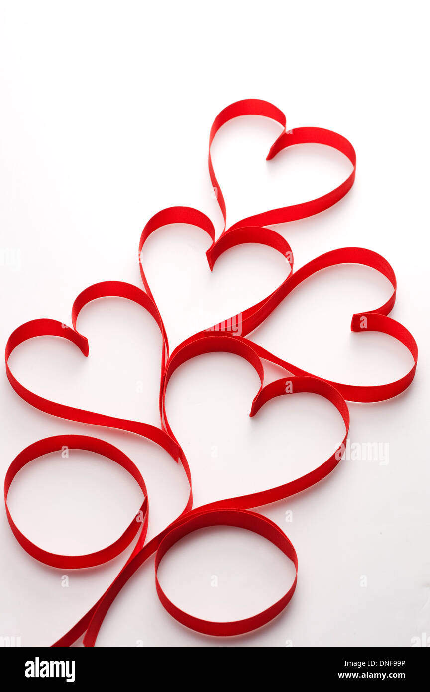 Red ribbons in heart shape Stock Photo - Alamy