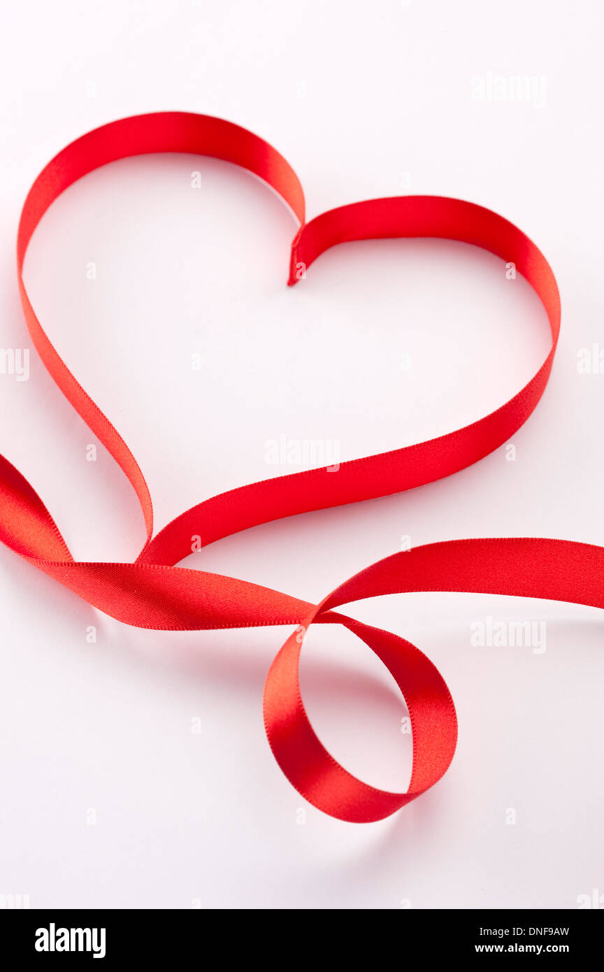 Red ribbons in heart shape Stock Photo - Alamy