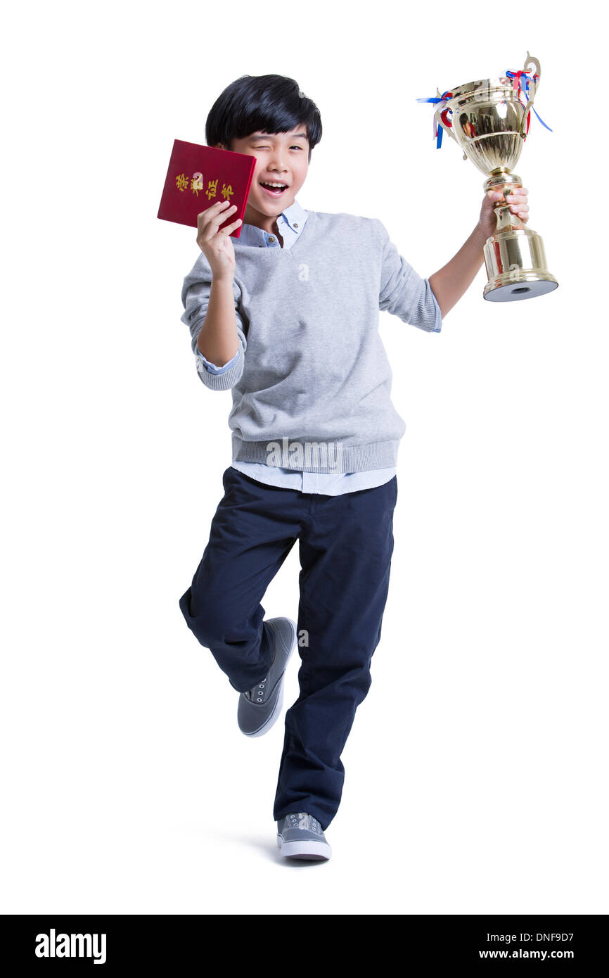 Cheerful boy with certificate and trophy Stock Photo - Alamy