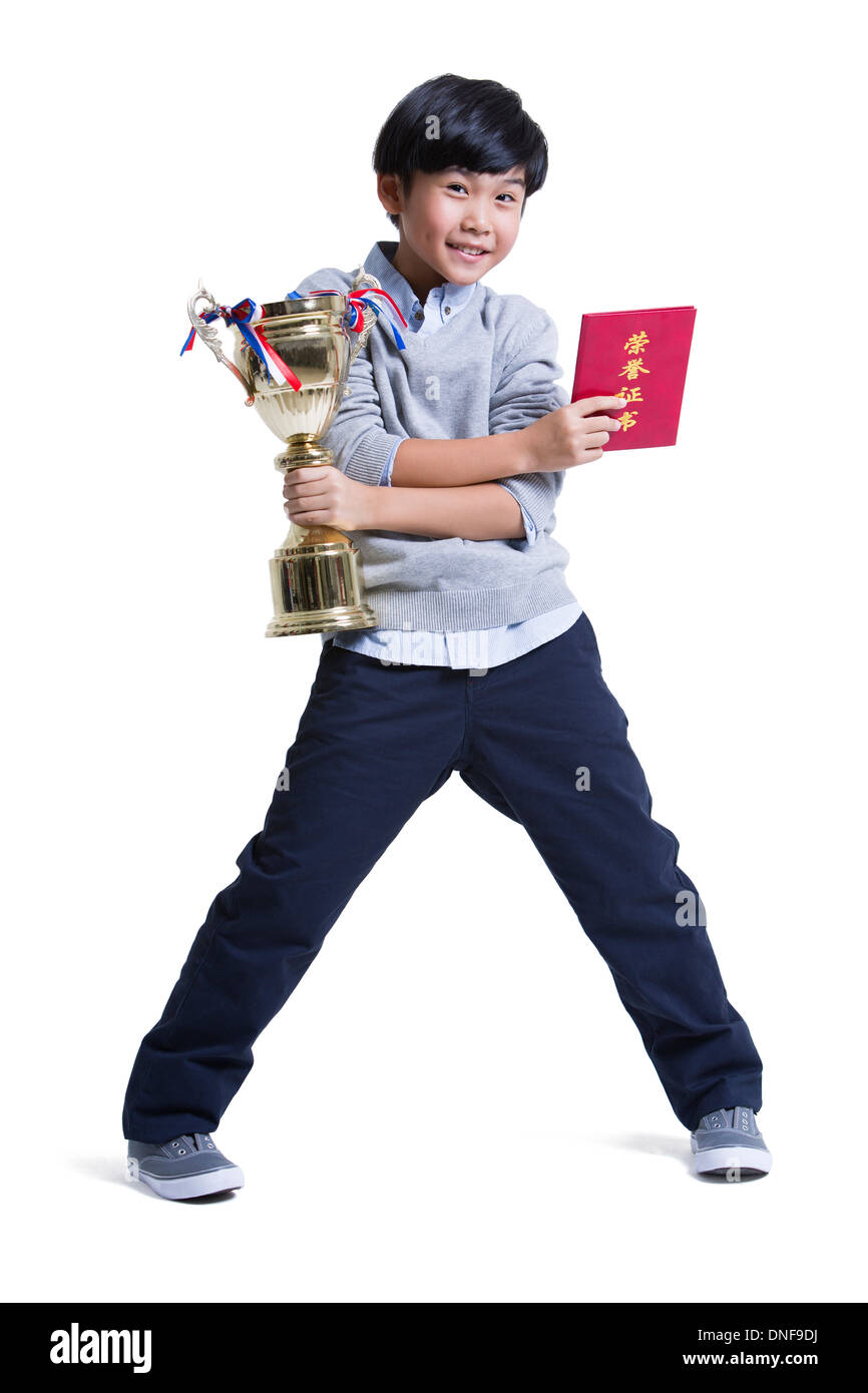 Cheerful boy with certificate and trophy Stock Photo - Alamy