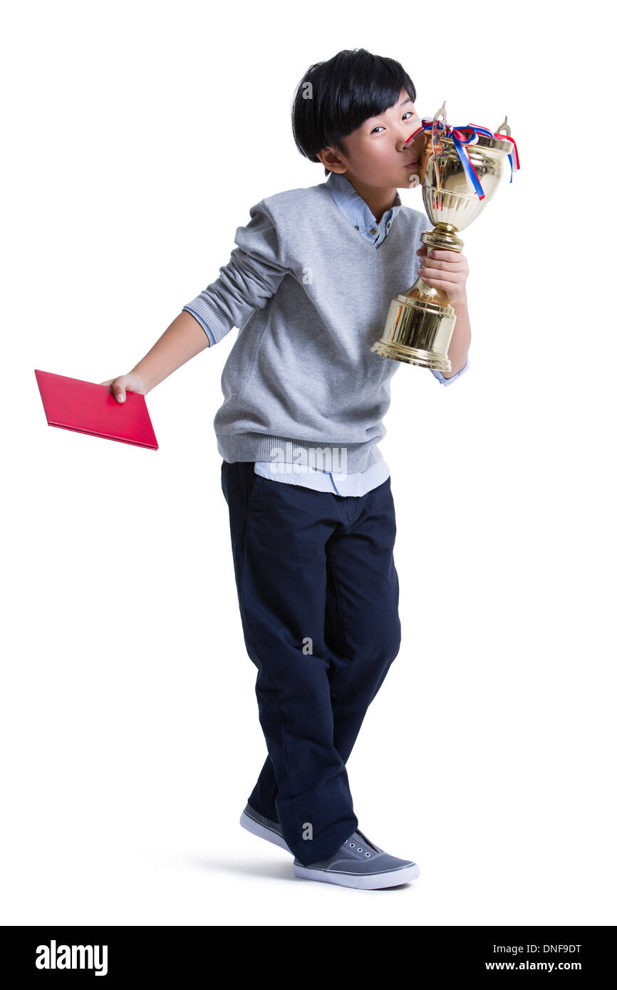 Cheerful boy with certificate and trophy Stock Photo - Alamy