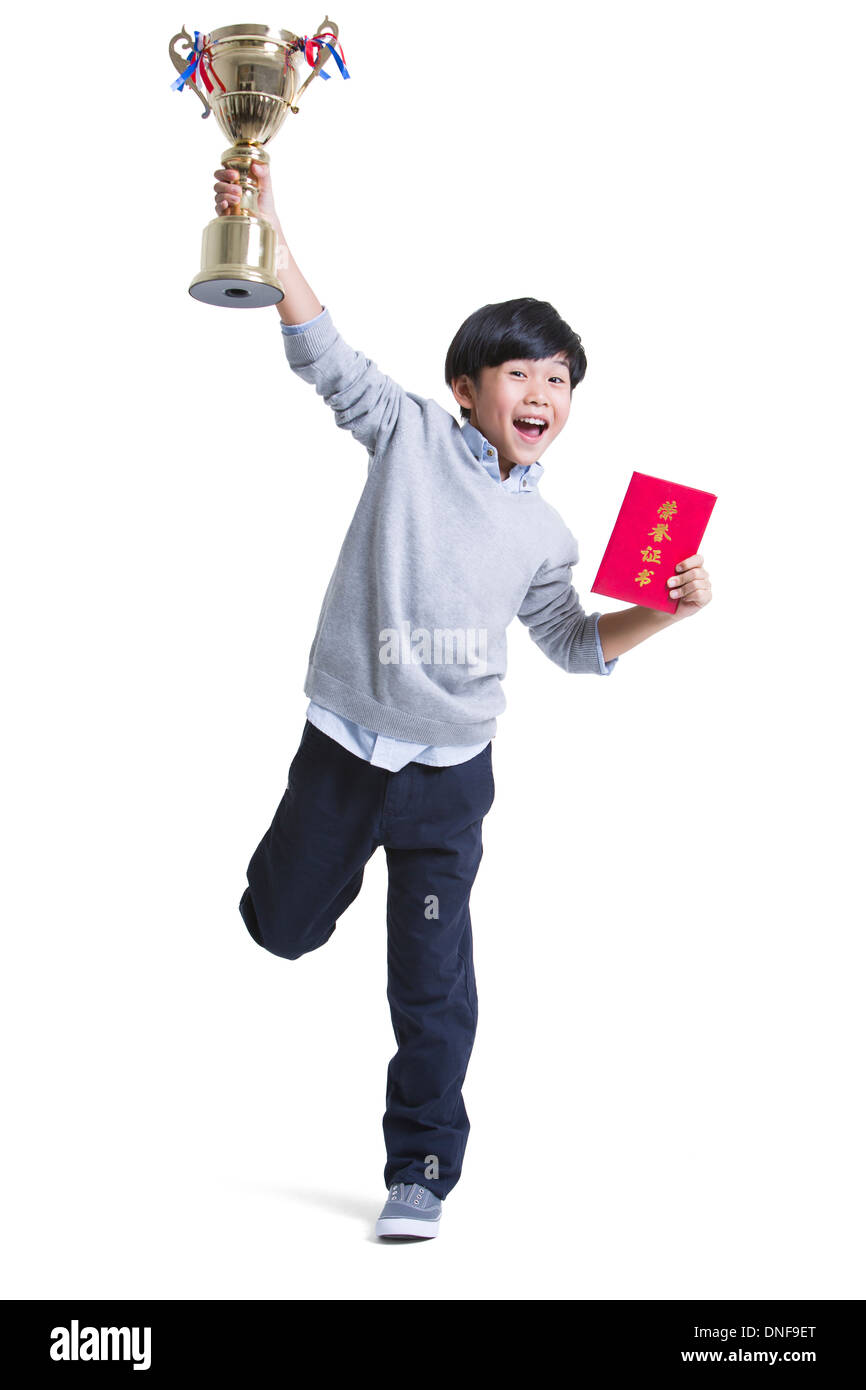 Cheerful boy with certificate and trophy Stock Photo - Alamy