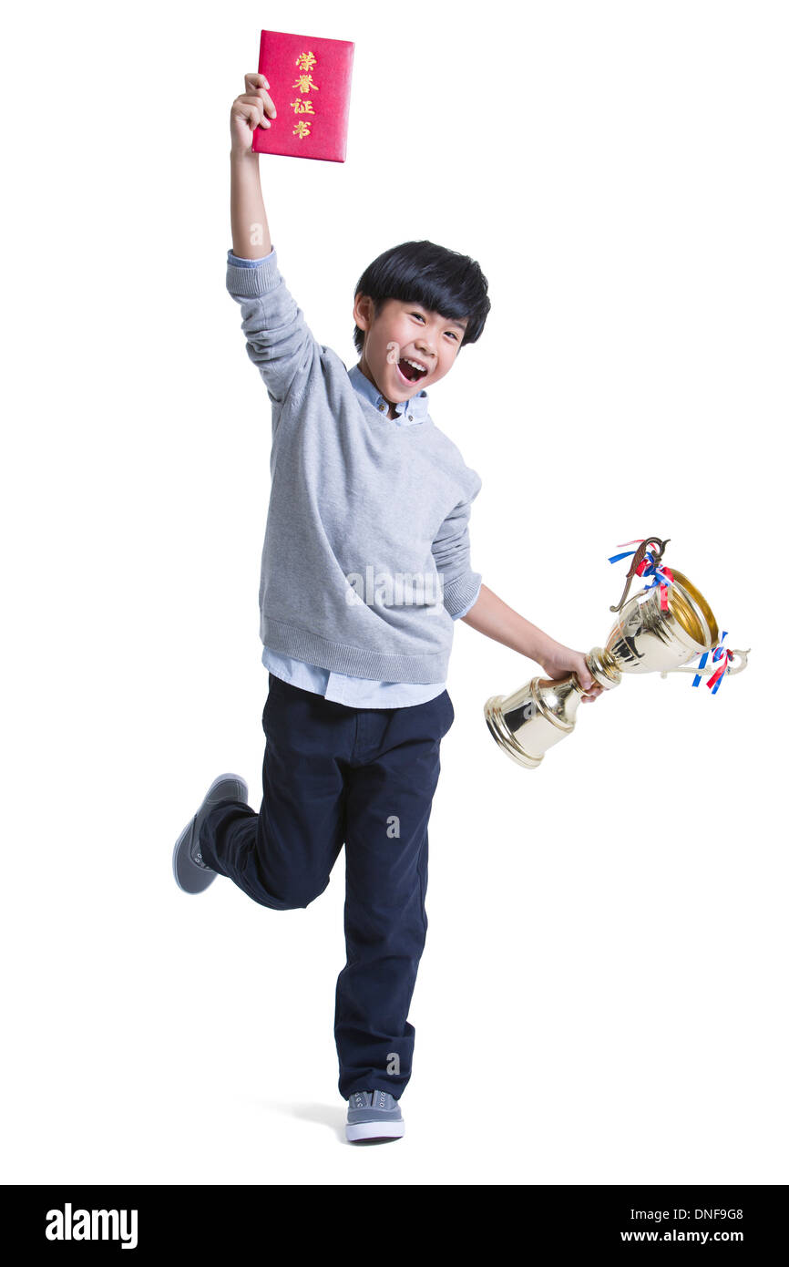 Cheerful boy with certificate and trophy Stock Photo - Alamy