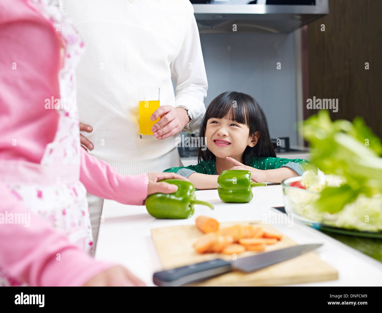 family talking in kitchen Stock Photo - Alamy