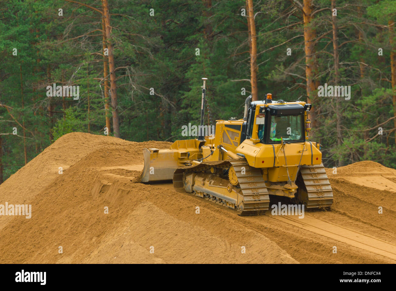 Yellow bulldozer at work Stock Photo - Alamy